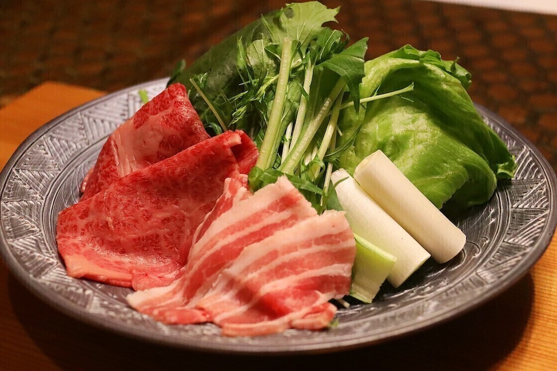Pork, beef and fresh green vegetables