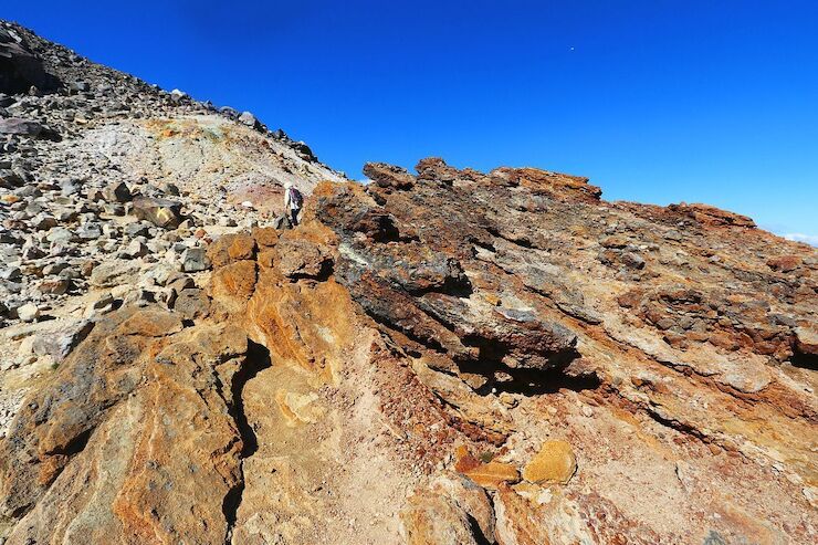A steep, rocky path leads up to the summit